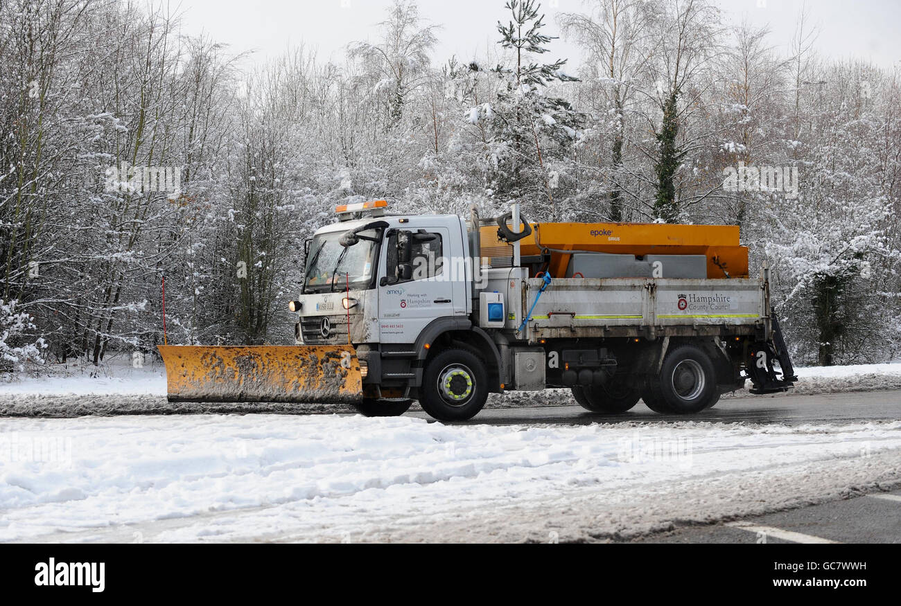 A snow plough is seen near the M3 motorway following overnight snowfall ...