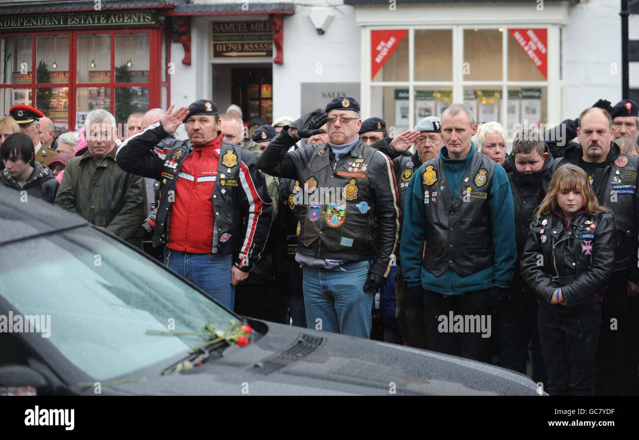 Mourners gather to pay their respects as three hearses containing the ...