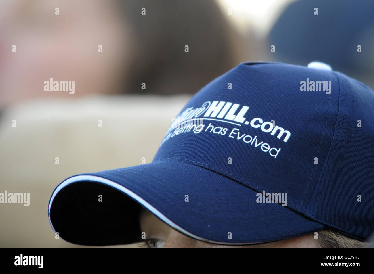 A young spectator wears a william hill cap in the stands Stock Photo ...