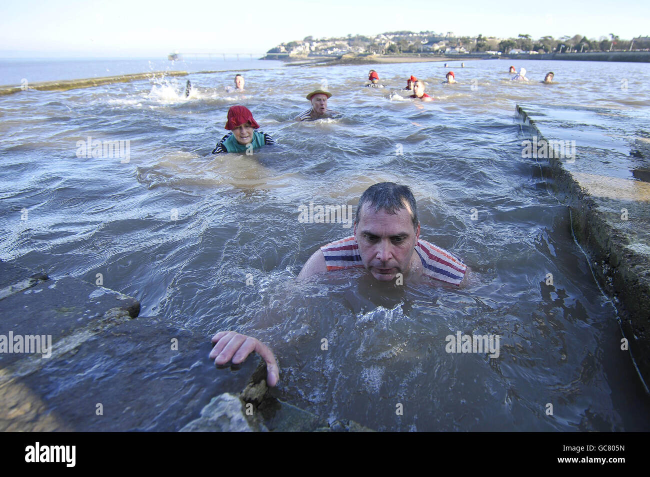 Swimmers in Victorian style bathing costumes during the annual New Year ...