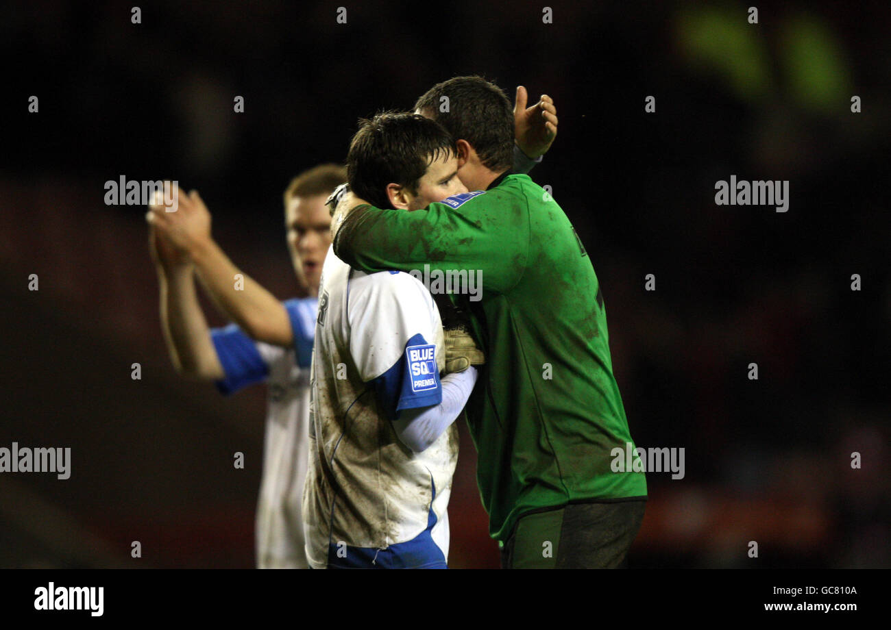 Barrow's Simon Spender and goalkeeper Tim Deasy stand dejected at the ...