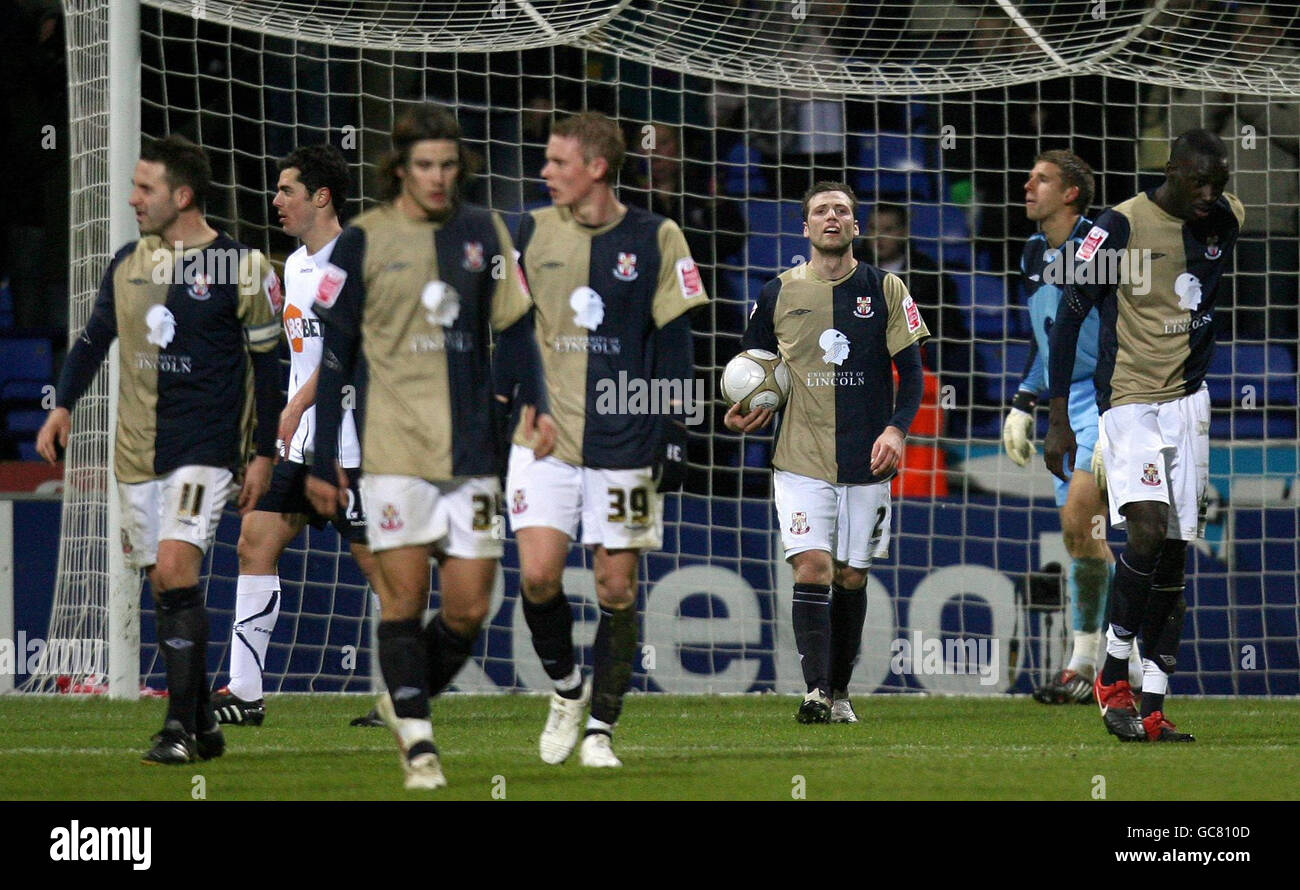 Lincoln City's Paul Green (third from right) and keeper Rob Burch show ...