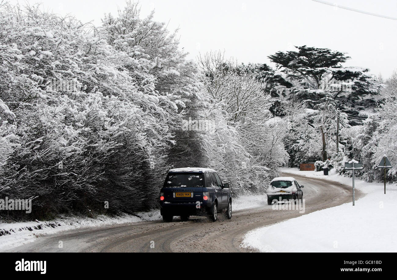 Commuters try to make their way to work after heavy overnight snow in ...