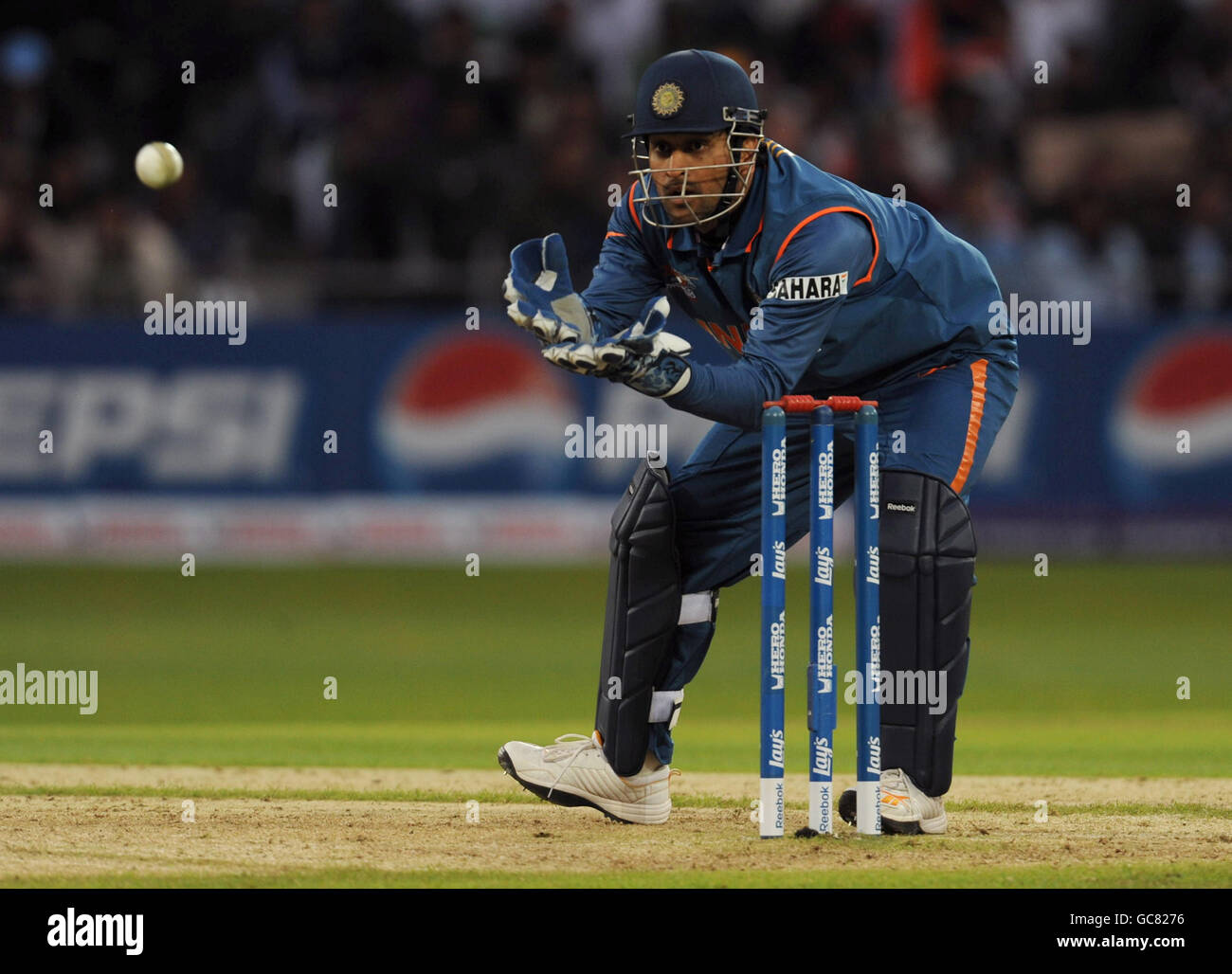 Wicket keeper catching cricket ball hi-res stock photography and images ...