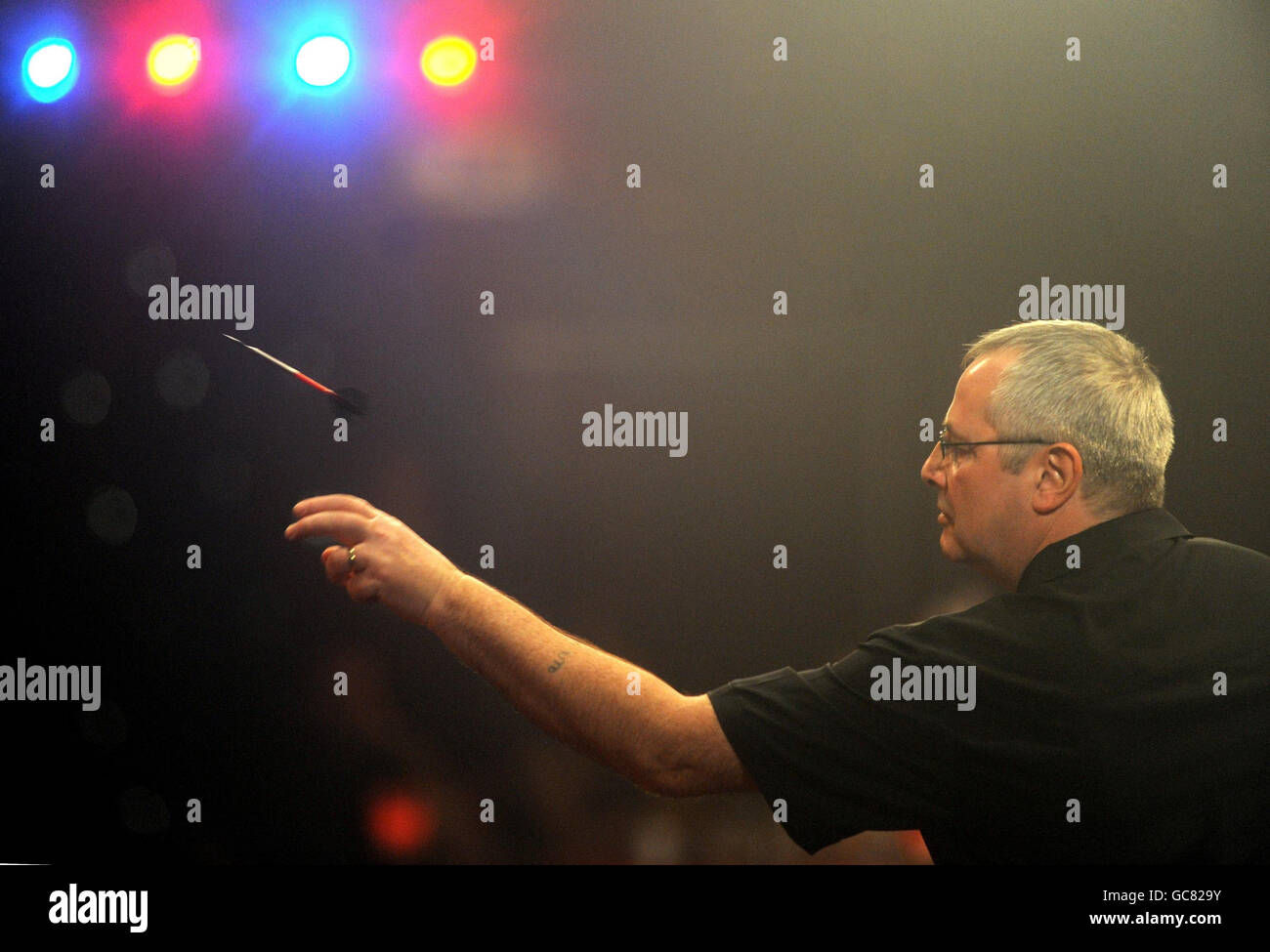 Martin Phillips (pictured) competes against Paul Carter during the BDO ...