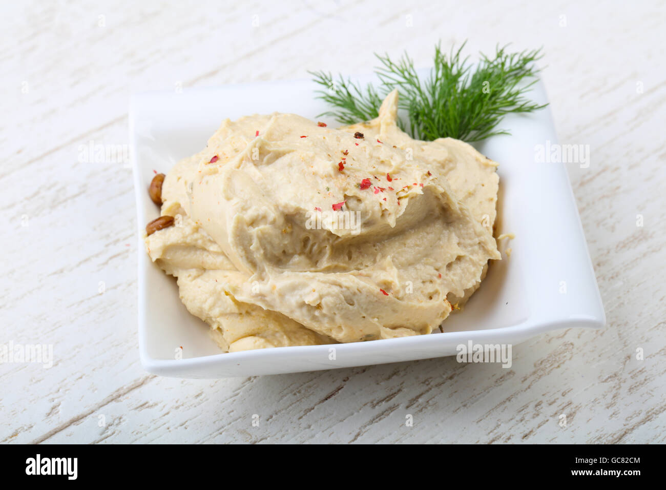 Arabic traditional cuisine - hummus with herbs and spices Stock Photo ...