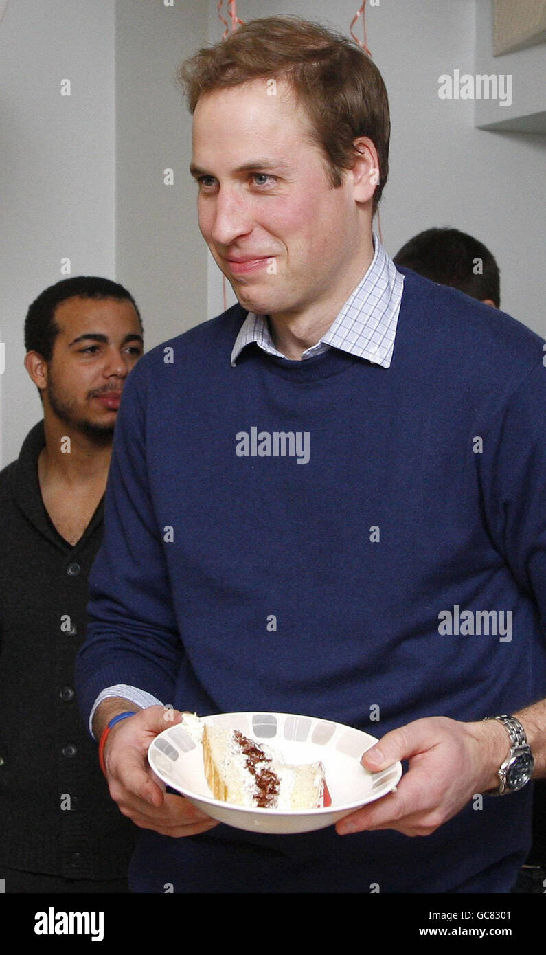 Britain's Prince William holds a bowl of birthday cake to celebrate the ...