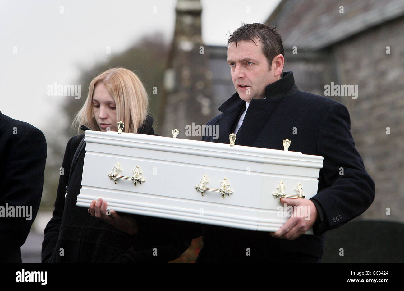 Edward Martin carries the coffin of Millie Martin, his 15-month old ...