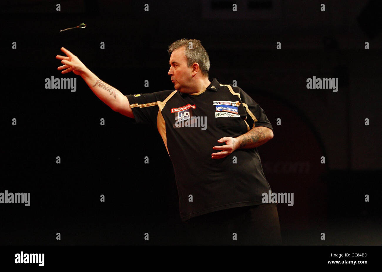 Phil Taylor in action against Colin Monk during the Ladbrokes.com World ...