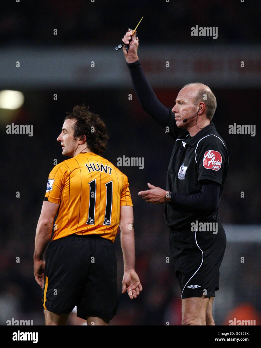 Hull City's Stephen Hunt is shown a yellow card by referee Steve ...