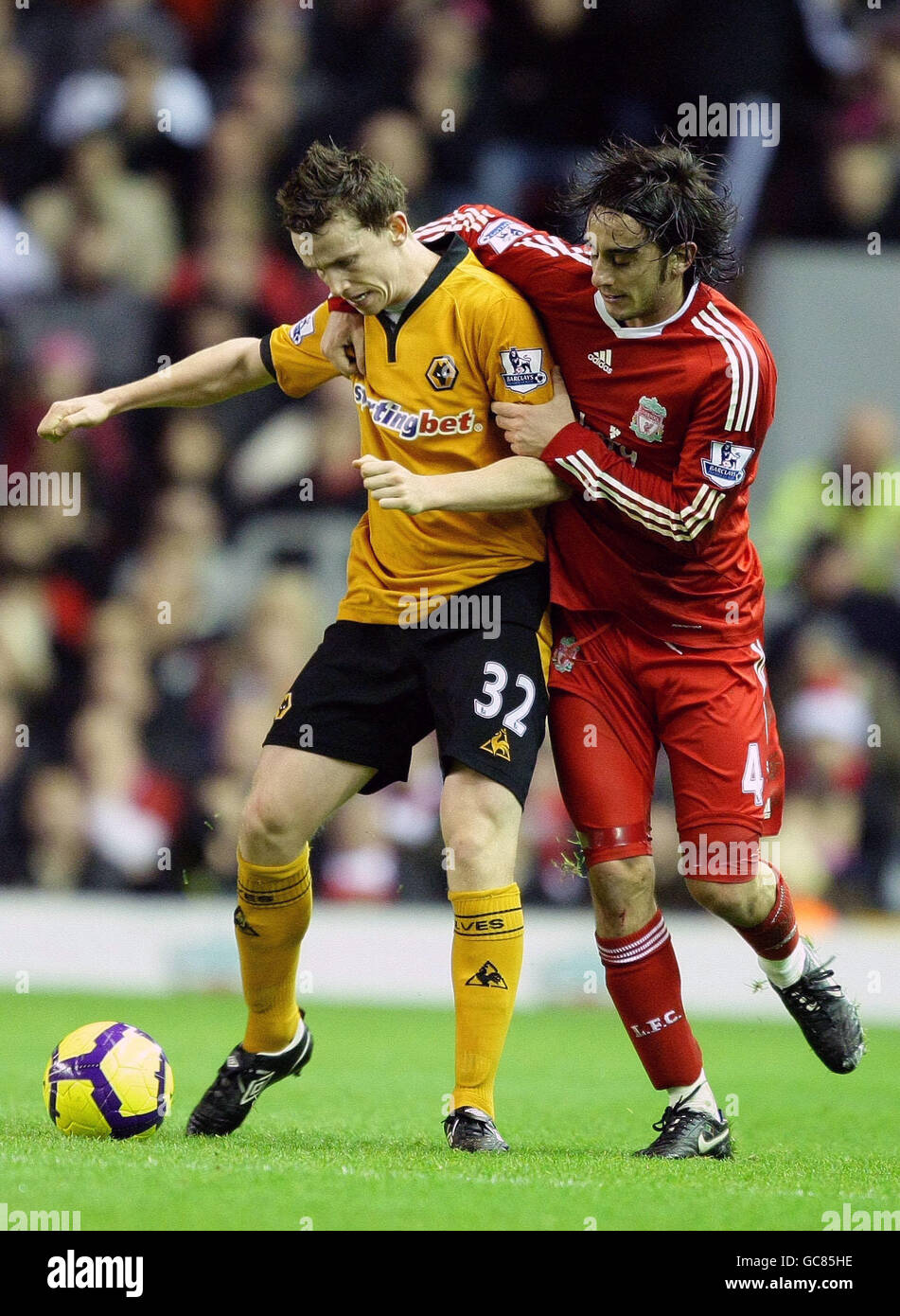 Wolverhampton Wanderers' Kevin Foley (left) and Liverpool's Alberto ...