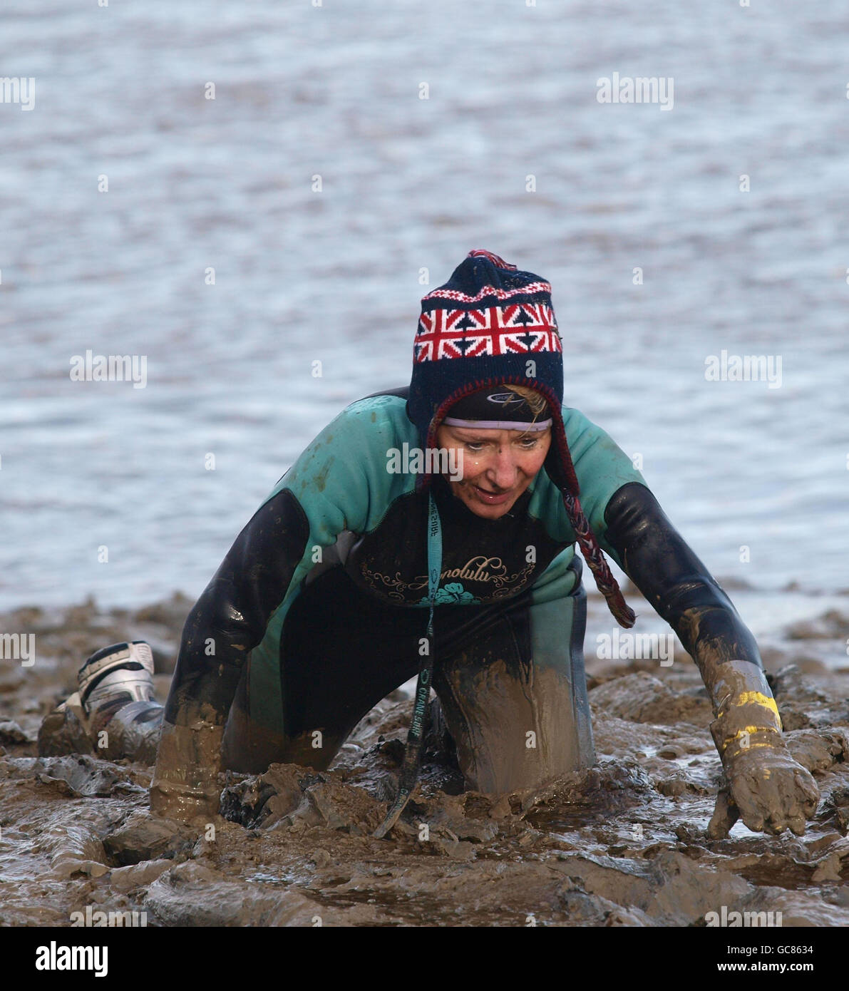 Avril Duckworth, aged 47 of Burnley, crawls up the bank towards the ...