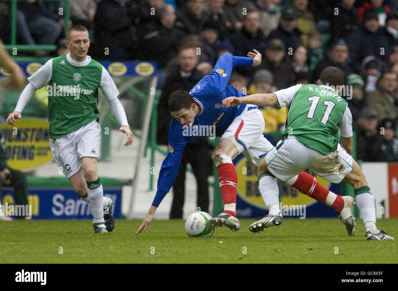 Rangers' Kyle Lafferty (centre) looks to get past Hibernian's Derek ...