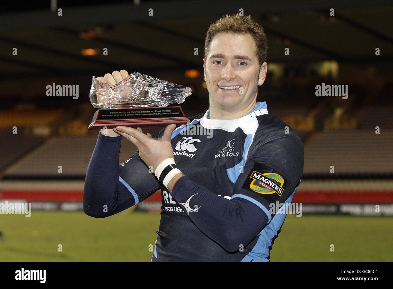 Glasgow Warriors' Dan Parks with a glass boot after becoming the first ...