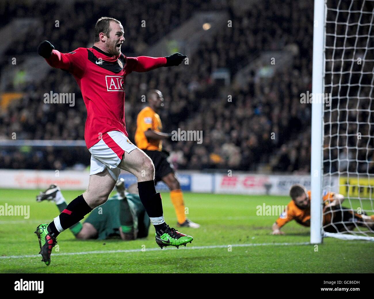Manchester United's Wayne Rooney (left) celebrates after his cross is ...
