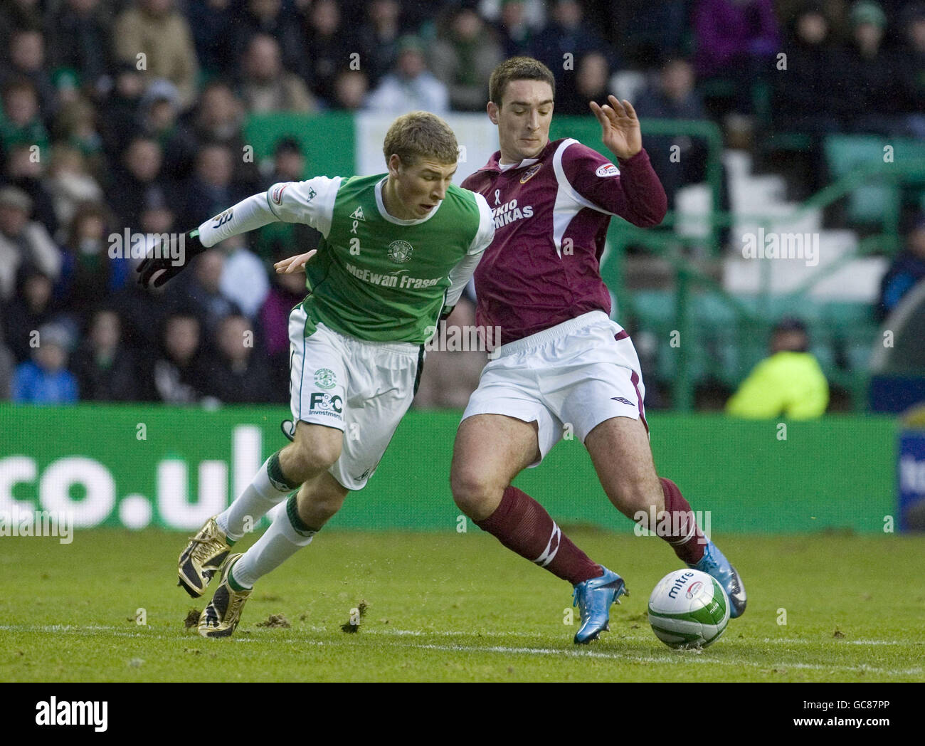 Hearts Lee Wallace (right) battles with Hibernian David Wotherspoon ...