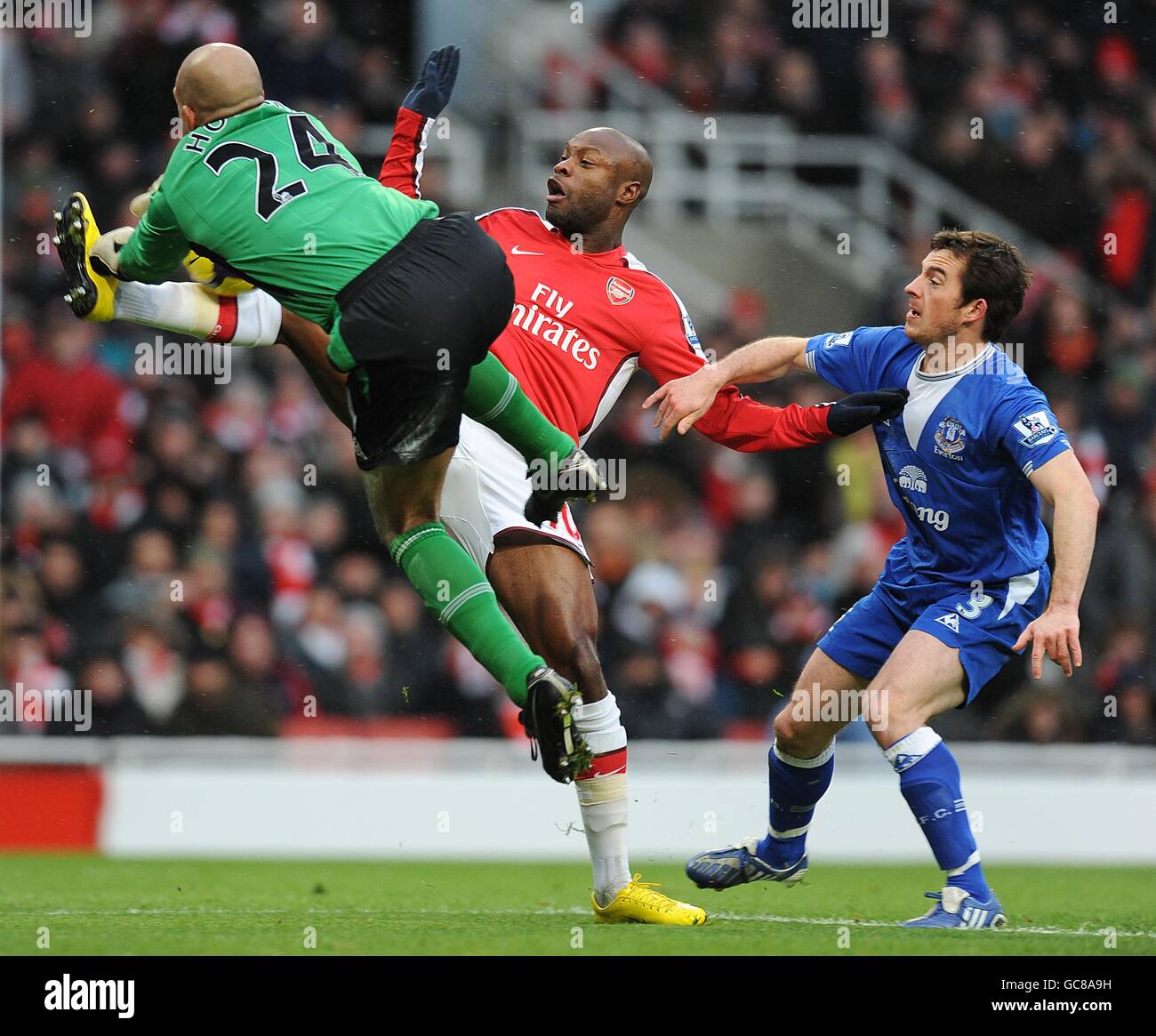 Everton's Leighton Baines (right) looks on as goalkeeper Tim Howard ...