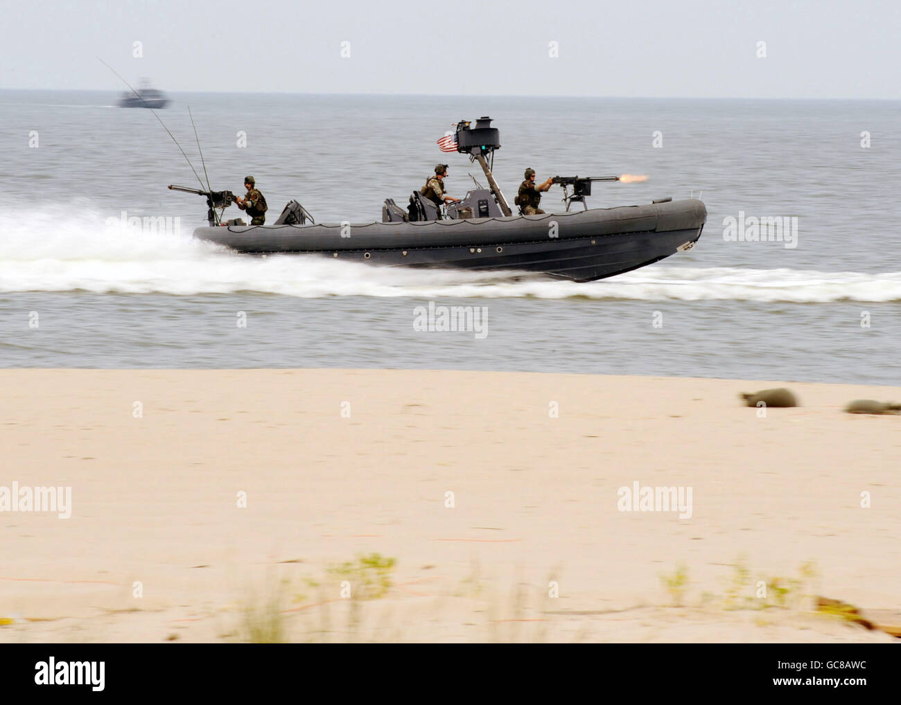 US Navy SEALS in a Special Warfare Combatant craft during a simulated ...
