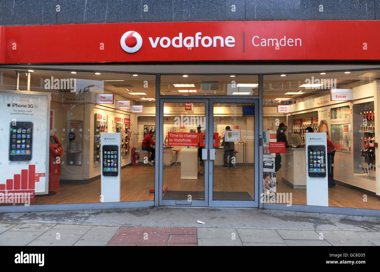 A general view of a Vodafone store shop window in Camden Town, north ...