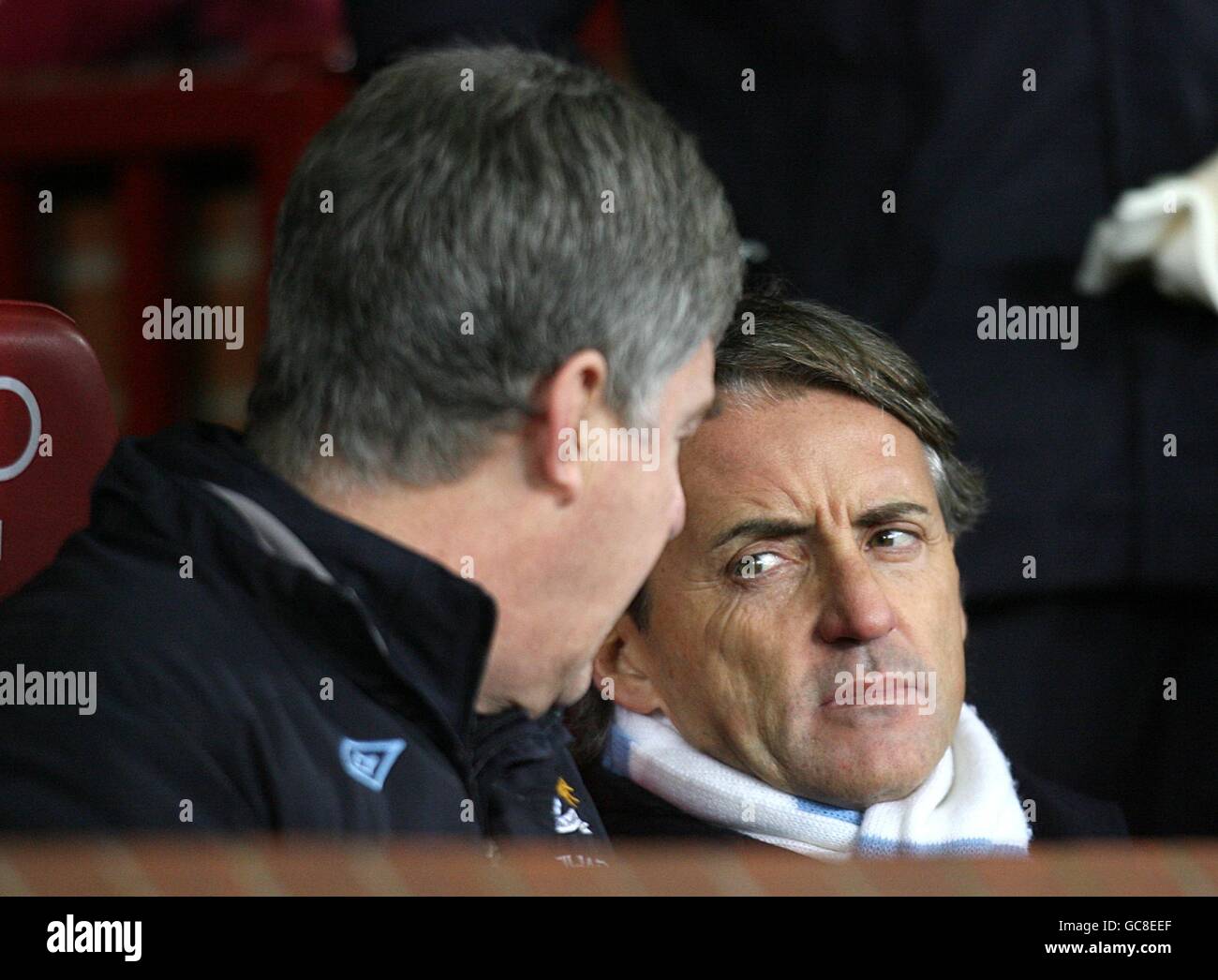 Manchester city manager roberto mancini his assistant brian kidd right ...