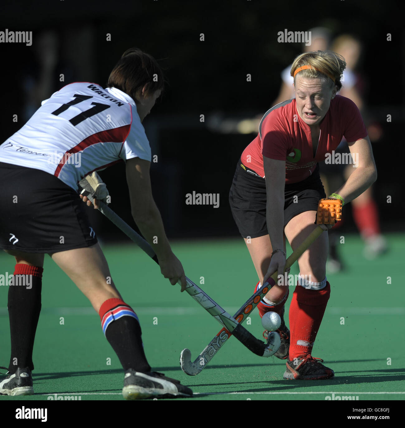Canterbury's Sarah Kerly (right) challenges with Bowdon's Sally Walton ...