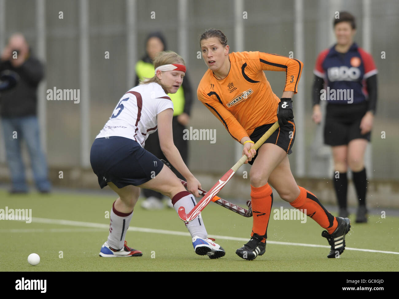 Leicester's Gemma Darringtin squeezes the ball past Olton's Emma McCabe ...