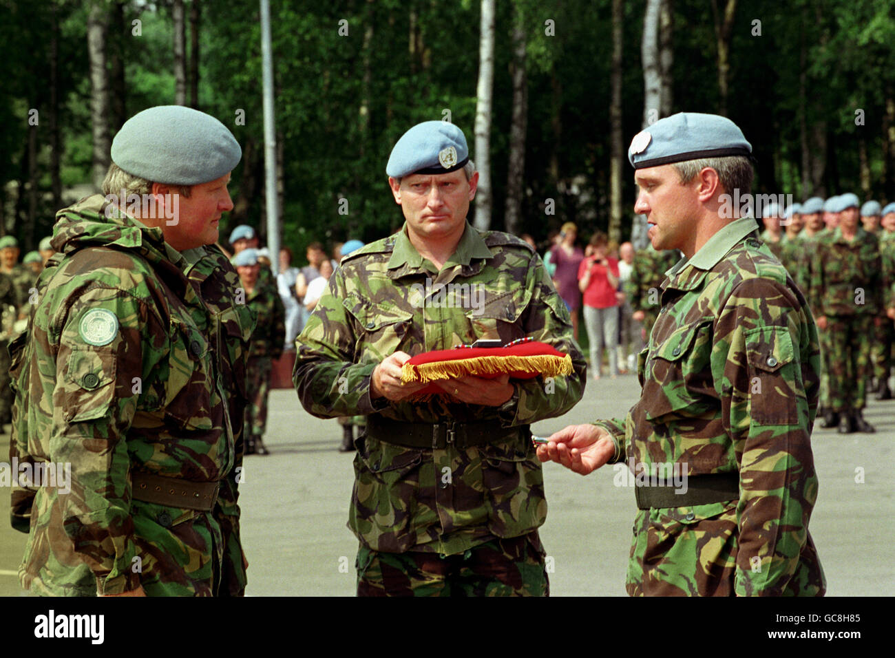 LT. COL BOB STEWART IS PRESENTED WITH HIS OWN U.N MEDAL BY THE OLDEST ...