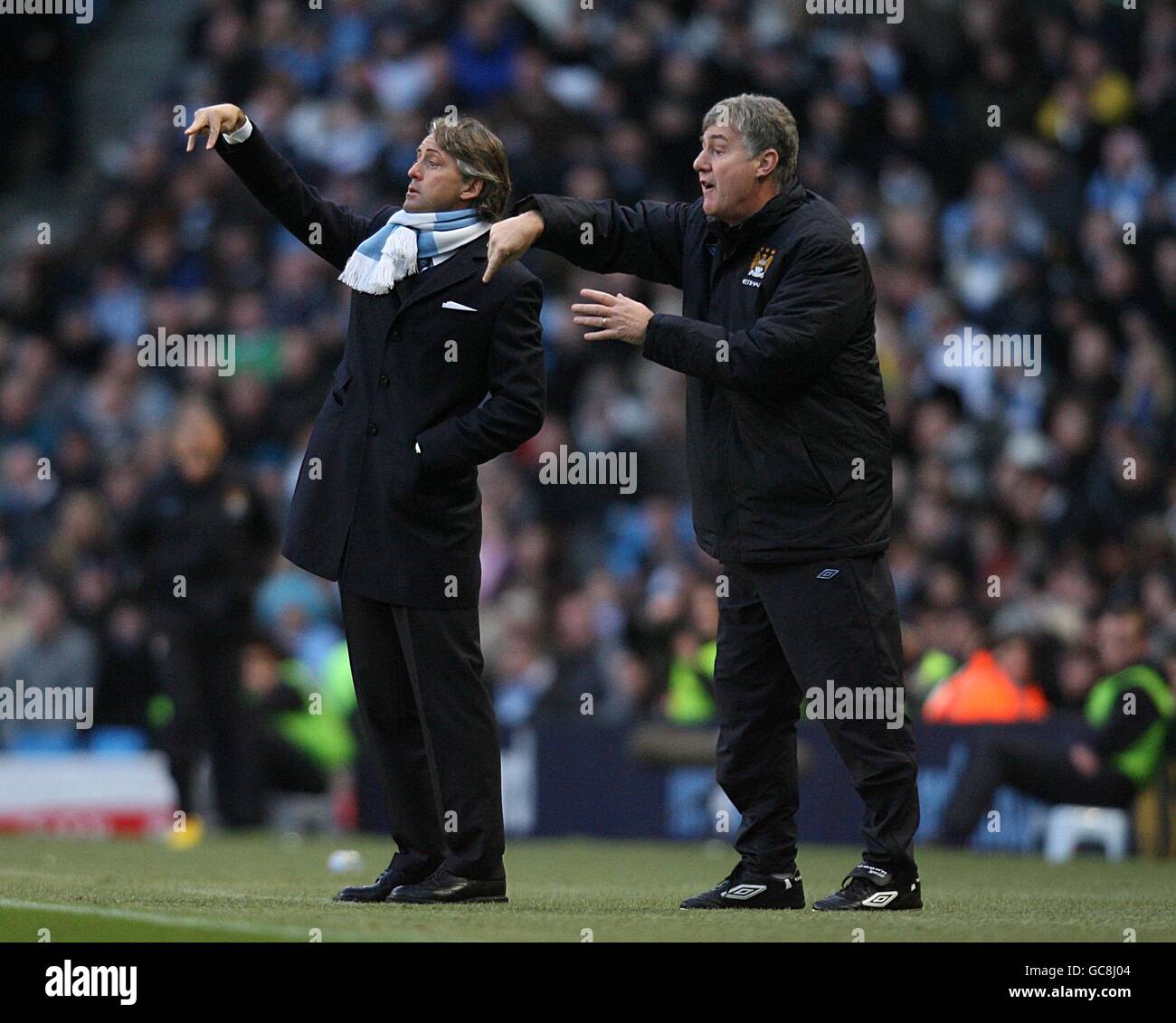 Manager roberto mancini and assistant brian kidd on the touchline hi ...