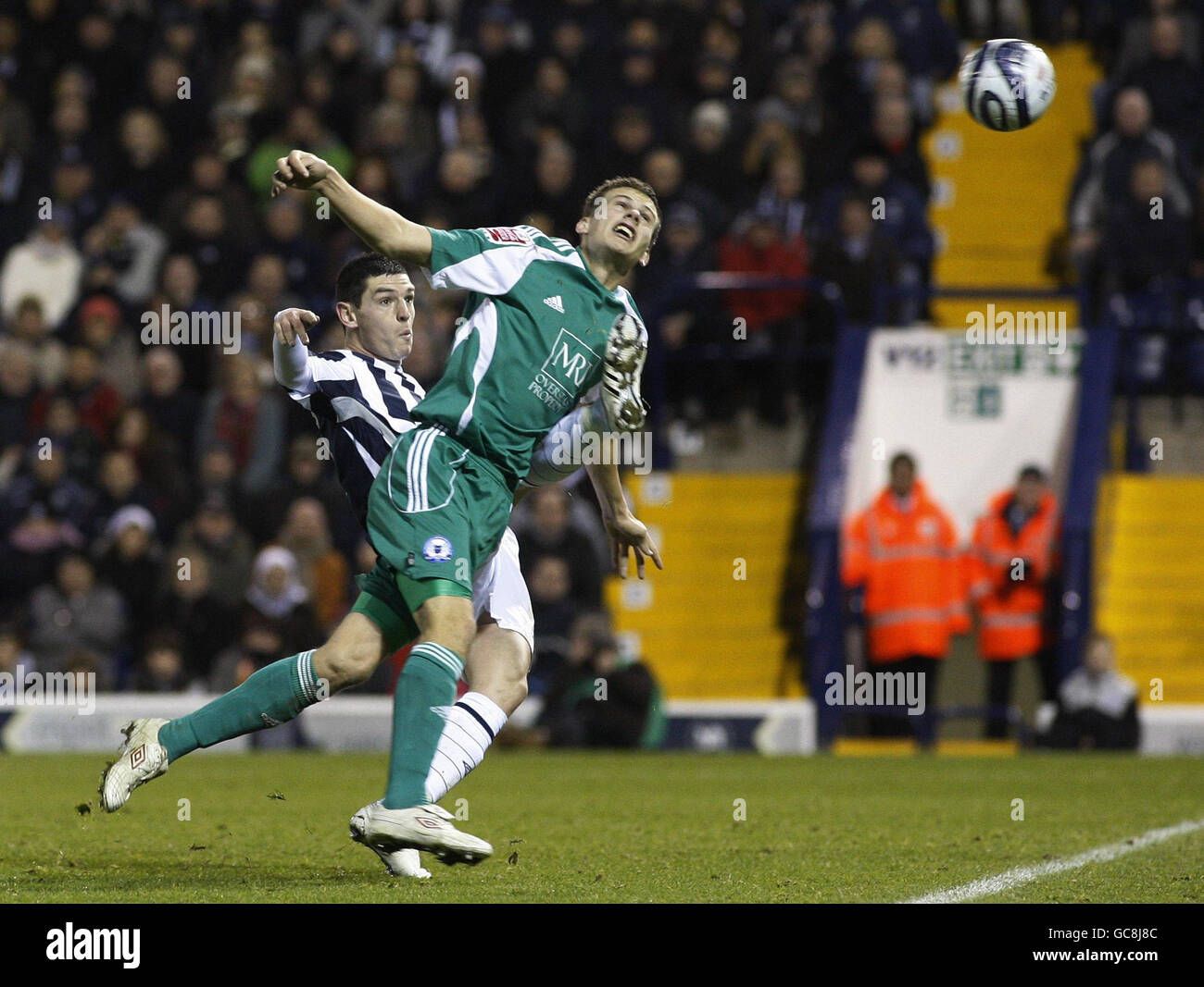 Peterborough United's Ryan Bennett heads into his own goal under ...