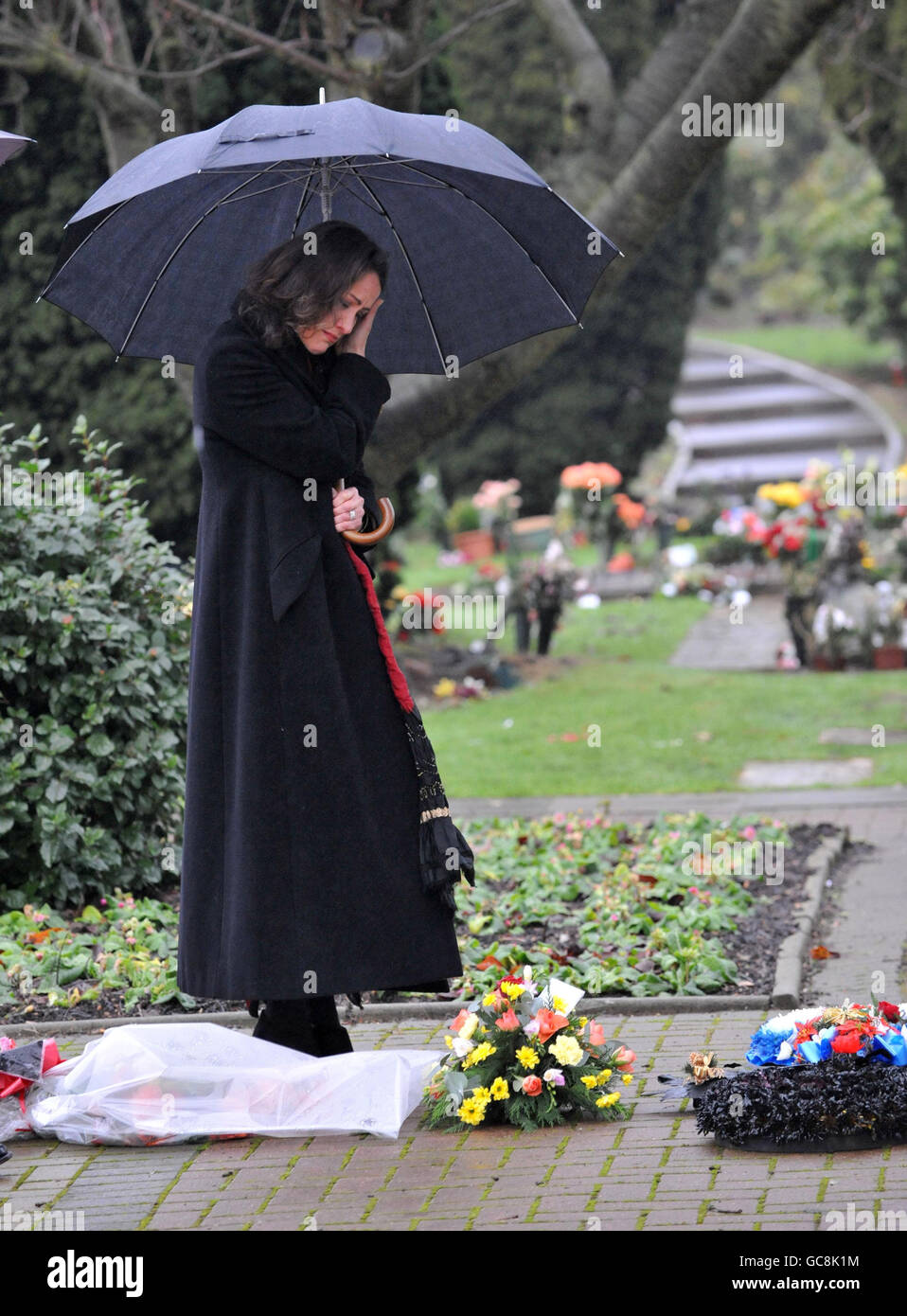 Michelle Baker views tributes at the funeral of her father Ken Baker at ...