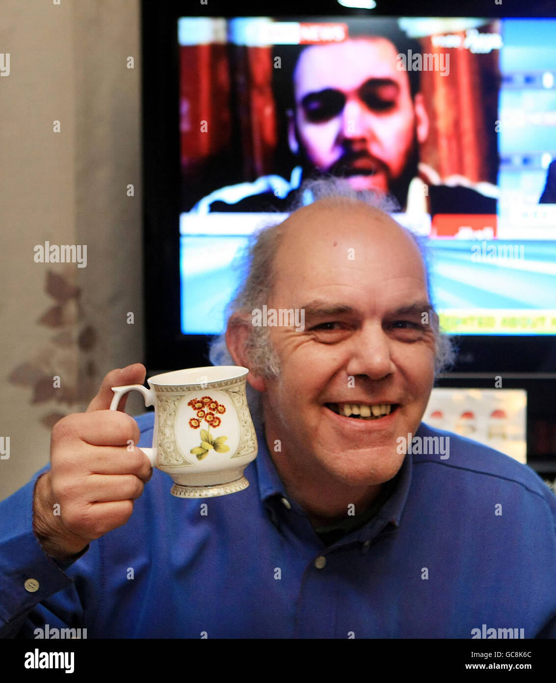 Graeme Moore toasts the release of his son Peter with a cup of tea at ...