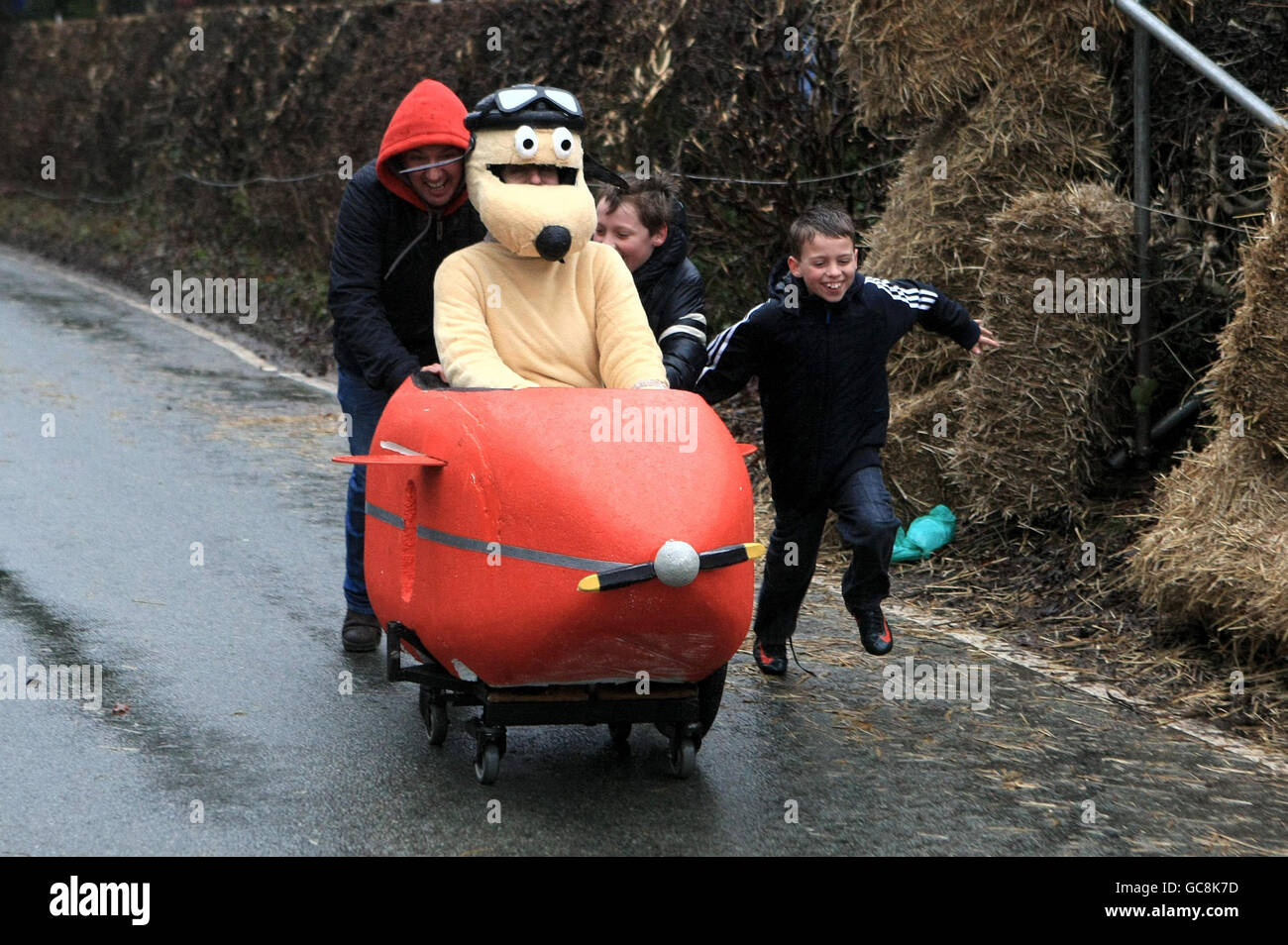 'Gromit' gets a push from an enthusiastic spectator after parting ...