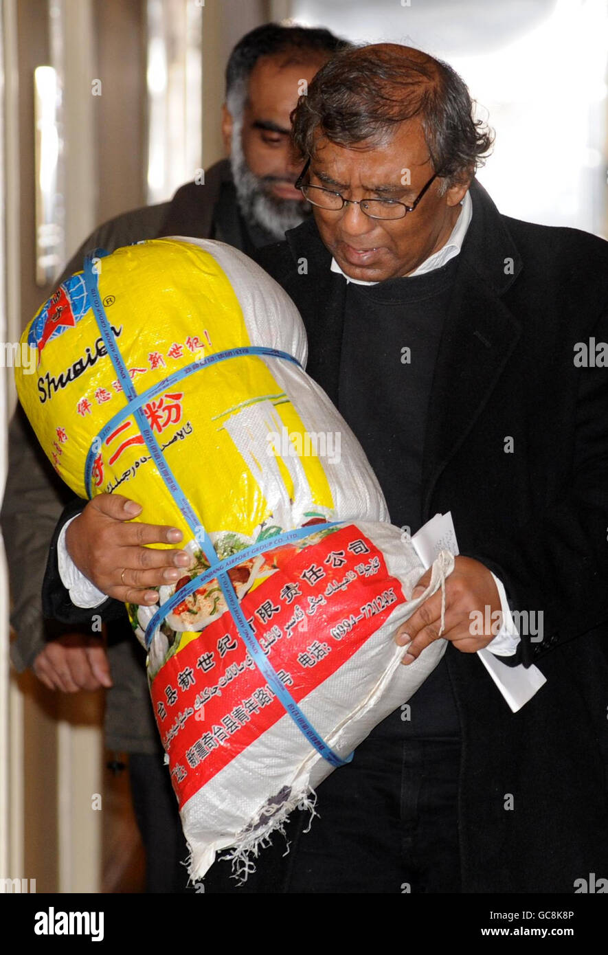 Akbar Shaikh (centre) brother of Akmal Shaikh, carries his brother's ...