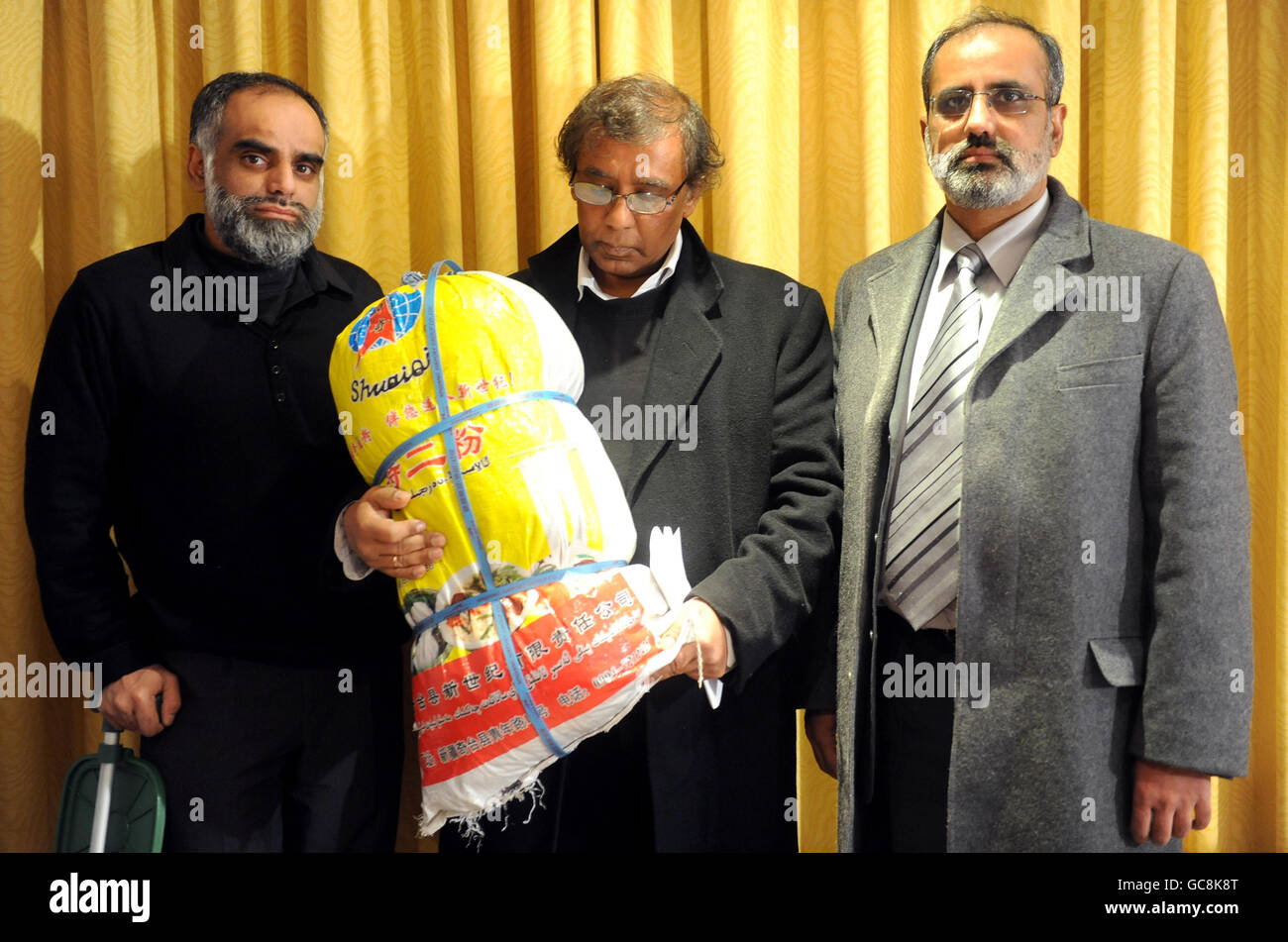 Akbar Shaikh (centre) brother of Akmal Shaikh, holds his brother's ...