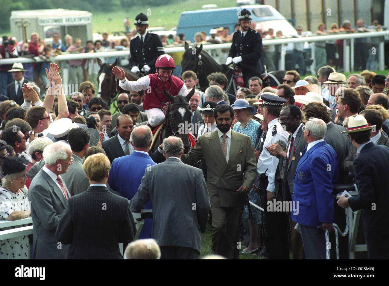 Intrepidity with M. Roberts up is lead into the Winner's Enclosure by ...
