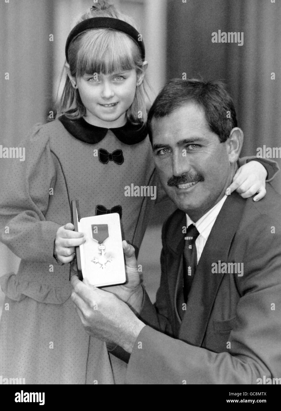 Graham gooch with his daughter after receiving his obe Black and White ...