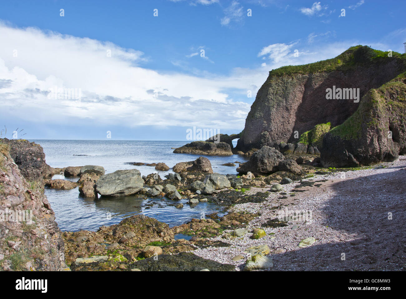Cushendun cove caves Stock Photo - Alamy