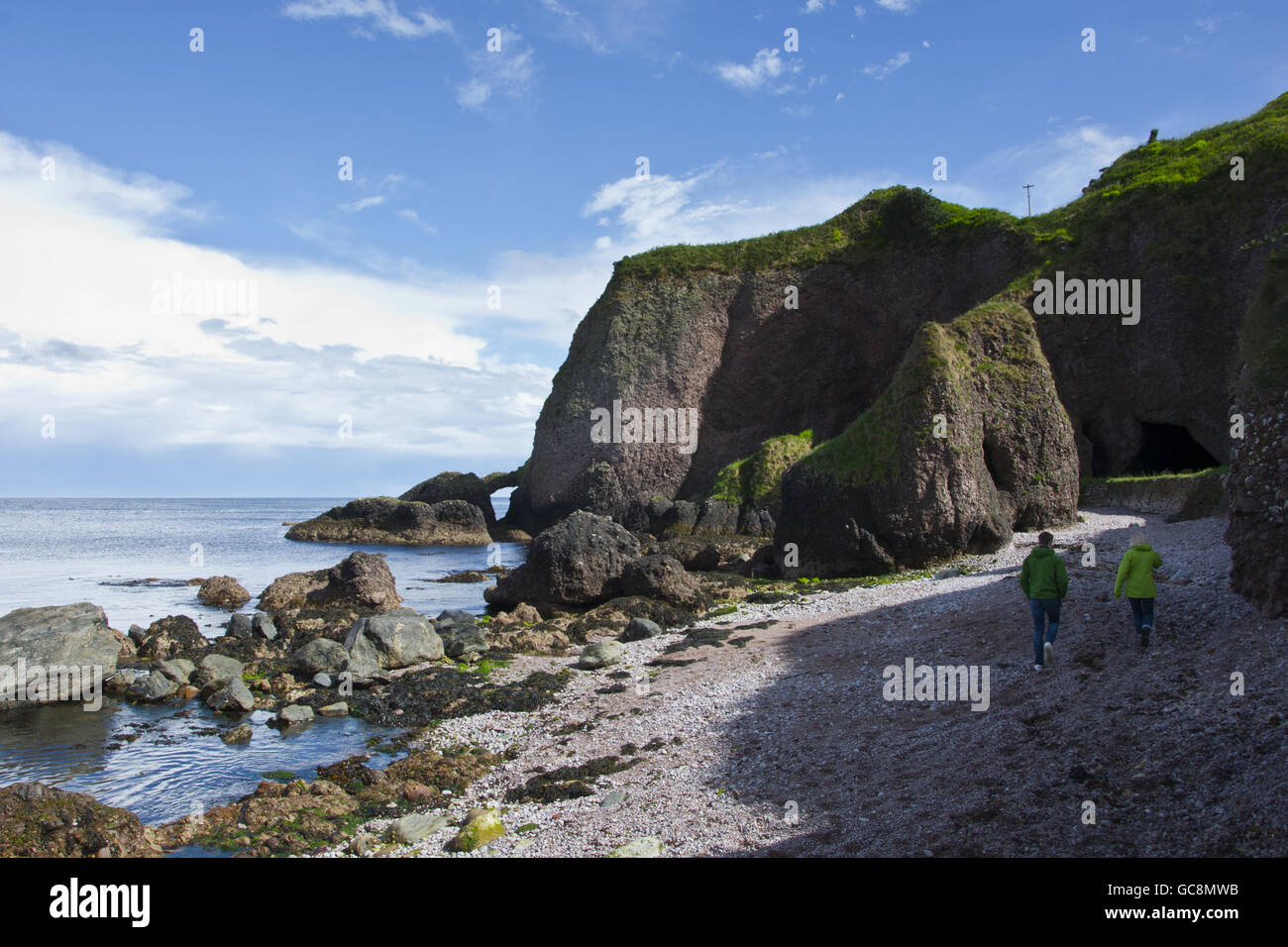 Cushendun cove caves Stock Photo - Alamy