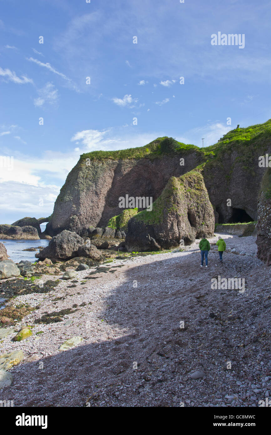 Cushendun cove caves Stock Photo - Alamy