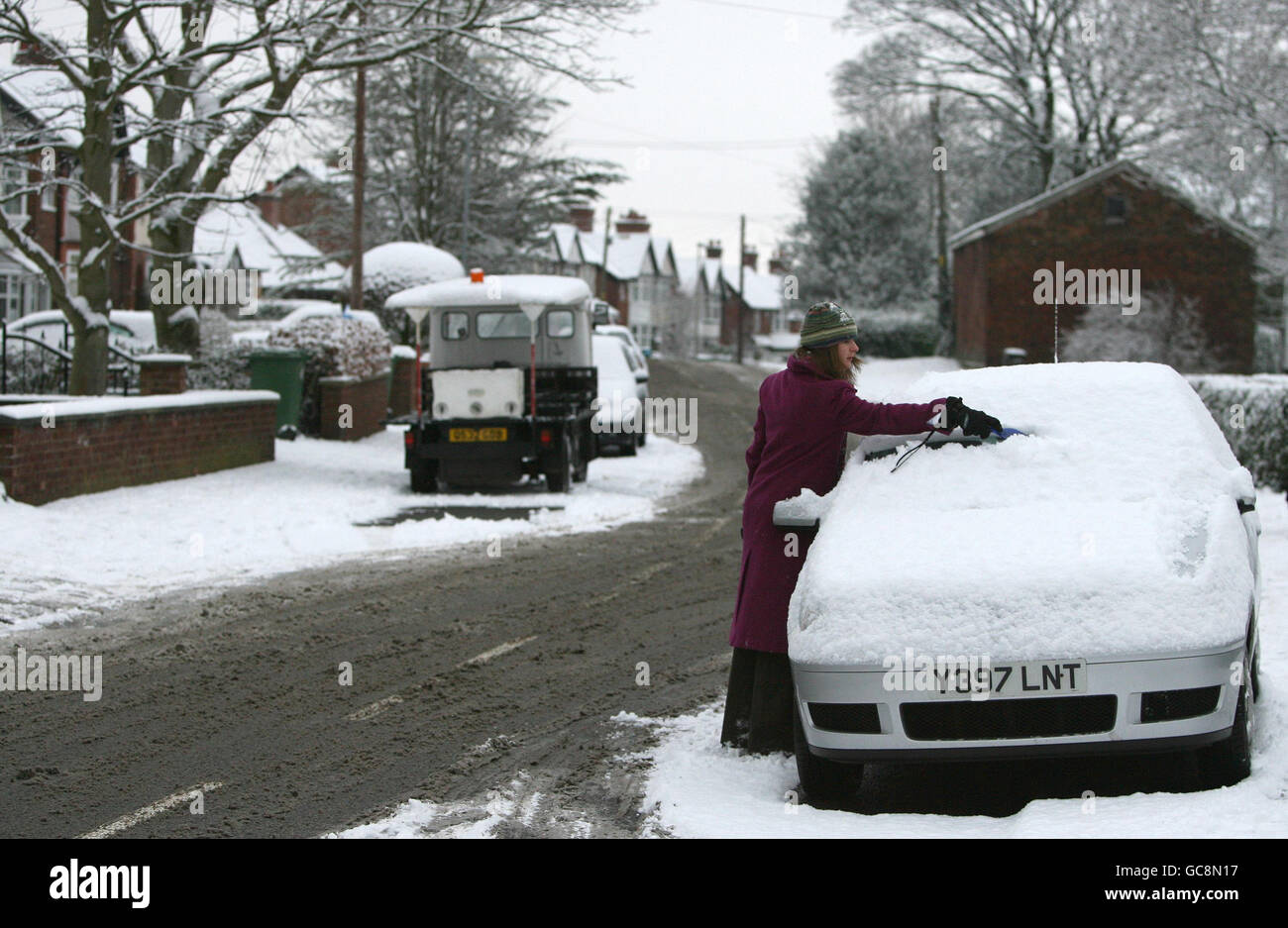 Woman removes snow from hi-res stock photography and images - Alamy