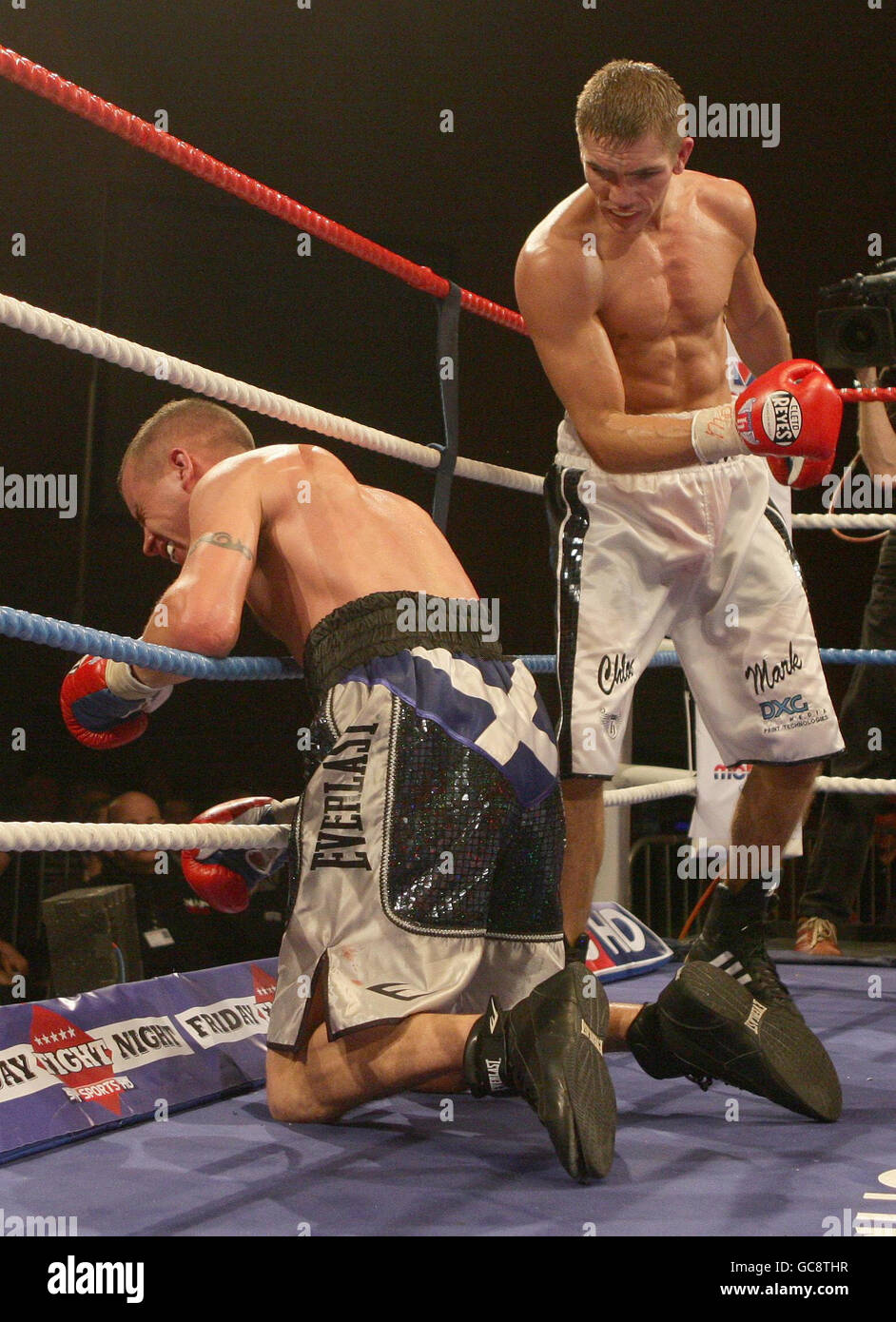 Mark Thompson (right) stands over Kevin McIntyre after knocking him ...