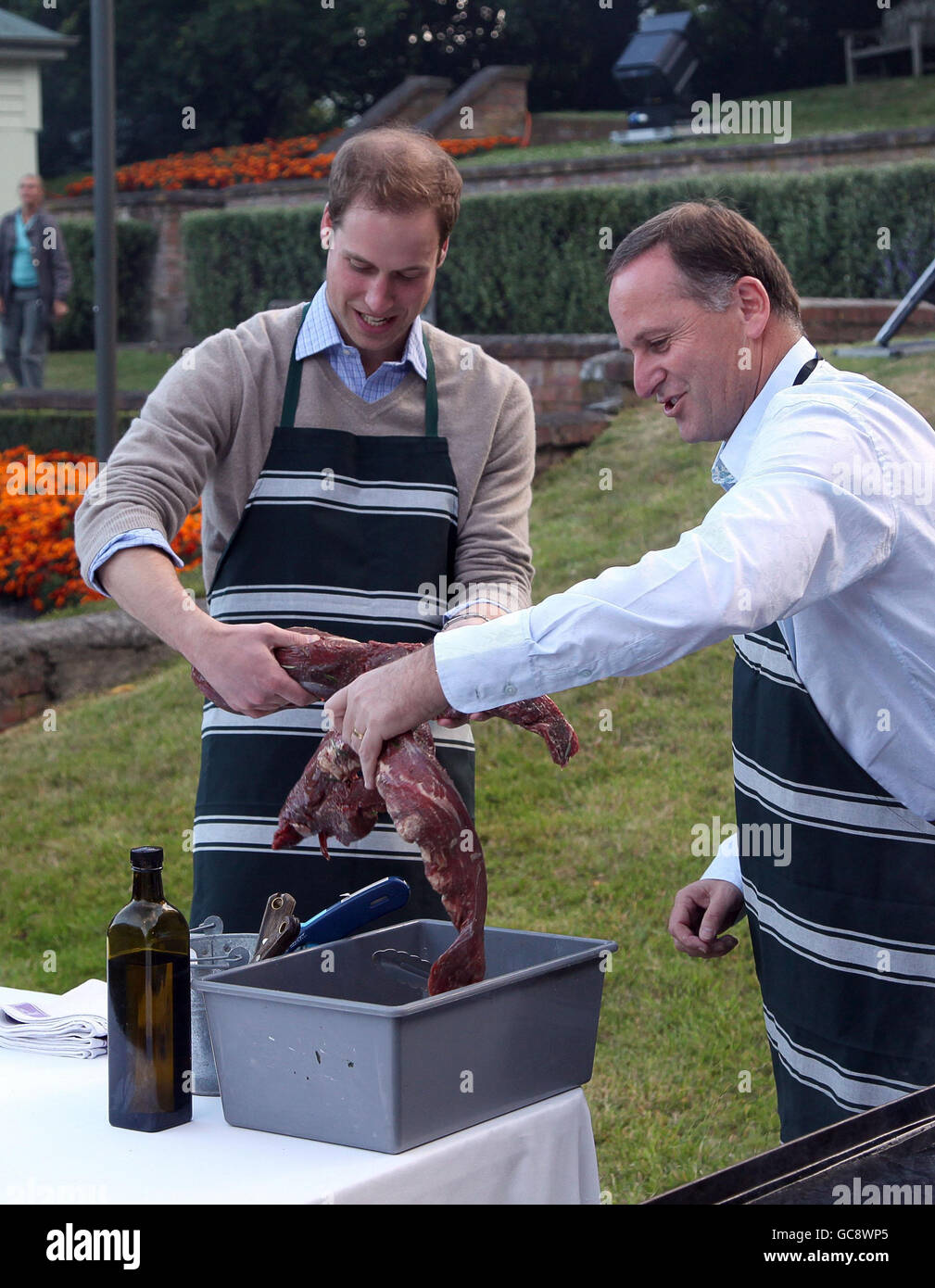 Prince William cooking a barbeque with the New Zealand Prime Minister ...