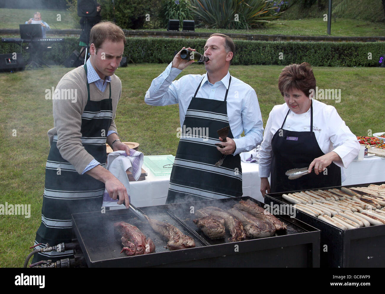 Prince William cooking a barbeque with the New Zealand Prime Minister ...