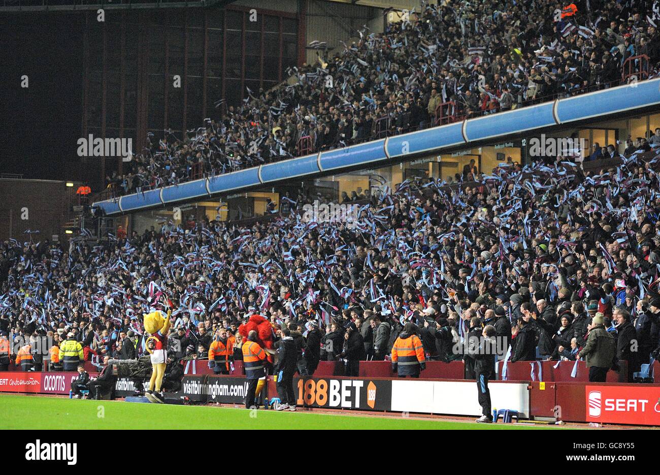 The Aston Villa fans and mascot celebrate in the stands Stock Photo - Alamy