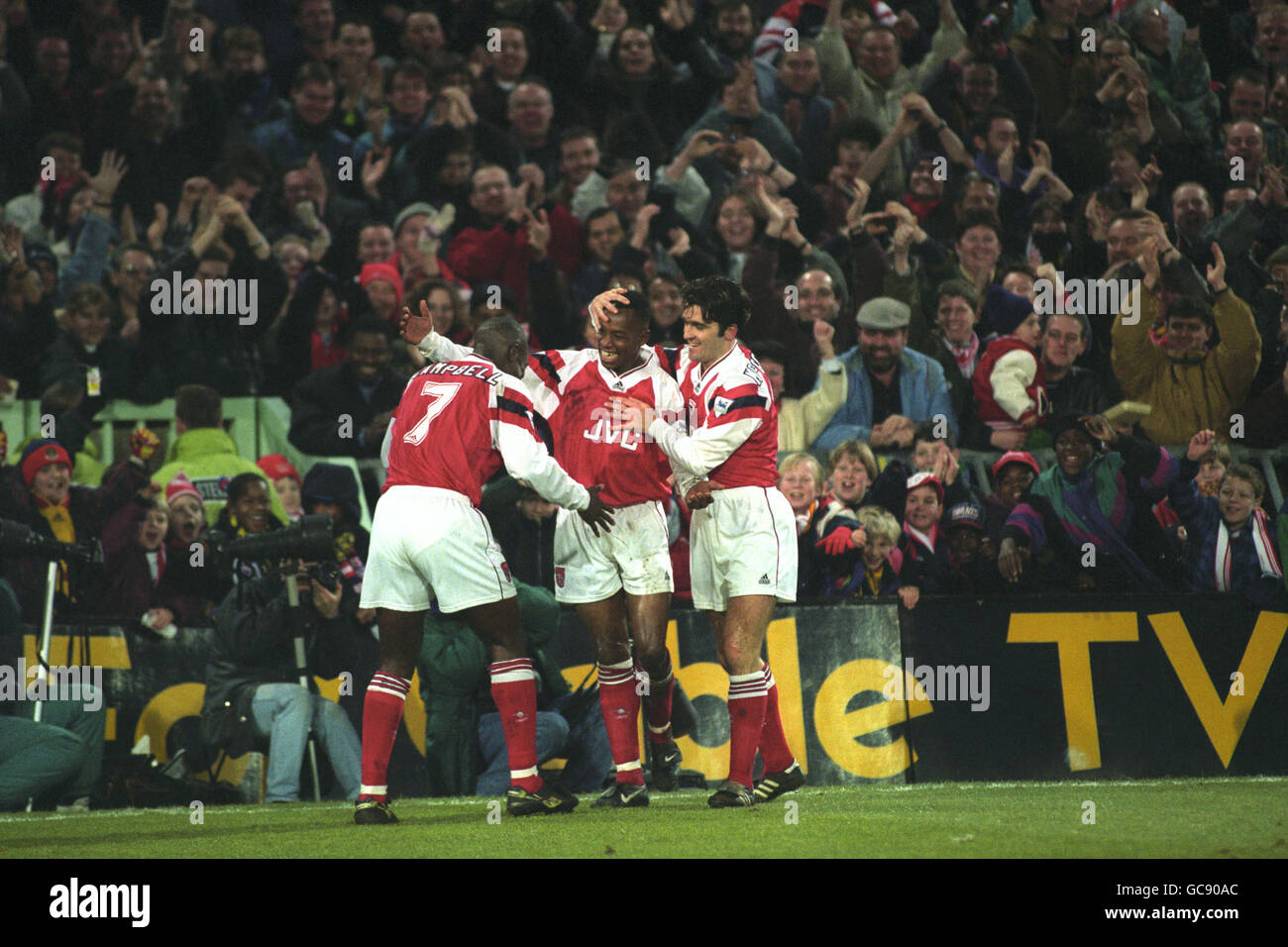 Arsenal's Ian Wright (c) is congratulated by Kevin Campbell (l) & Eddie ...
