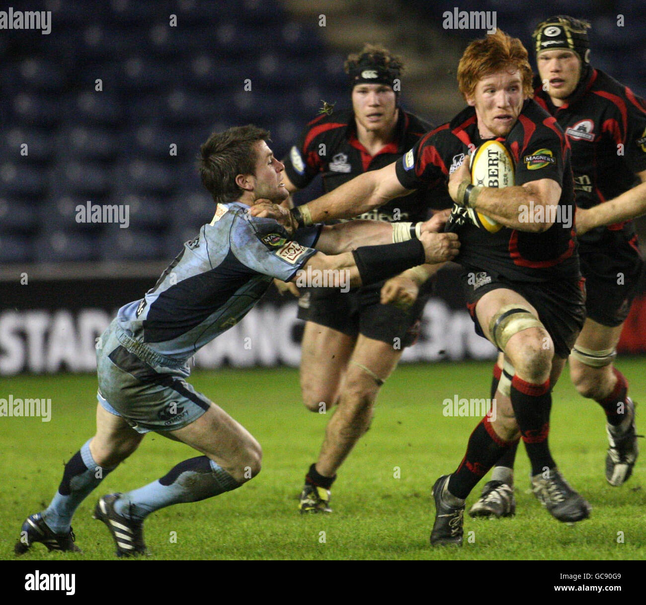 Edinburgh's Roddy Grant gets past Cardiff's Ceri Sweeney during the ...