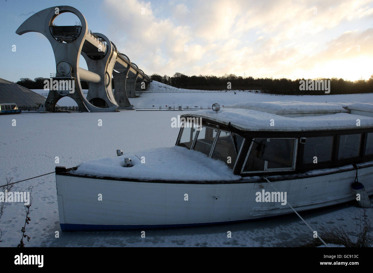The Falkirk Wheel in the snow on the frozen Forth and Clyde canal, near ...