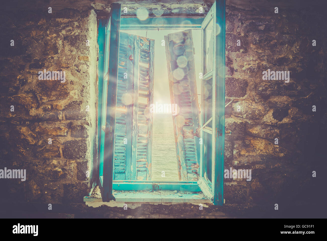 Old broken mysterious window and ray of light Stock Photo - Alamy