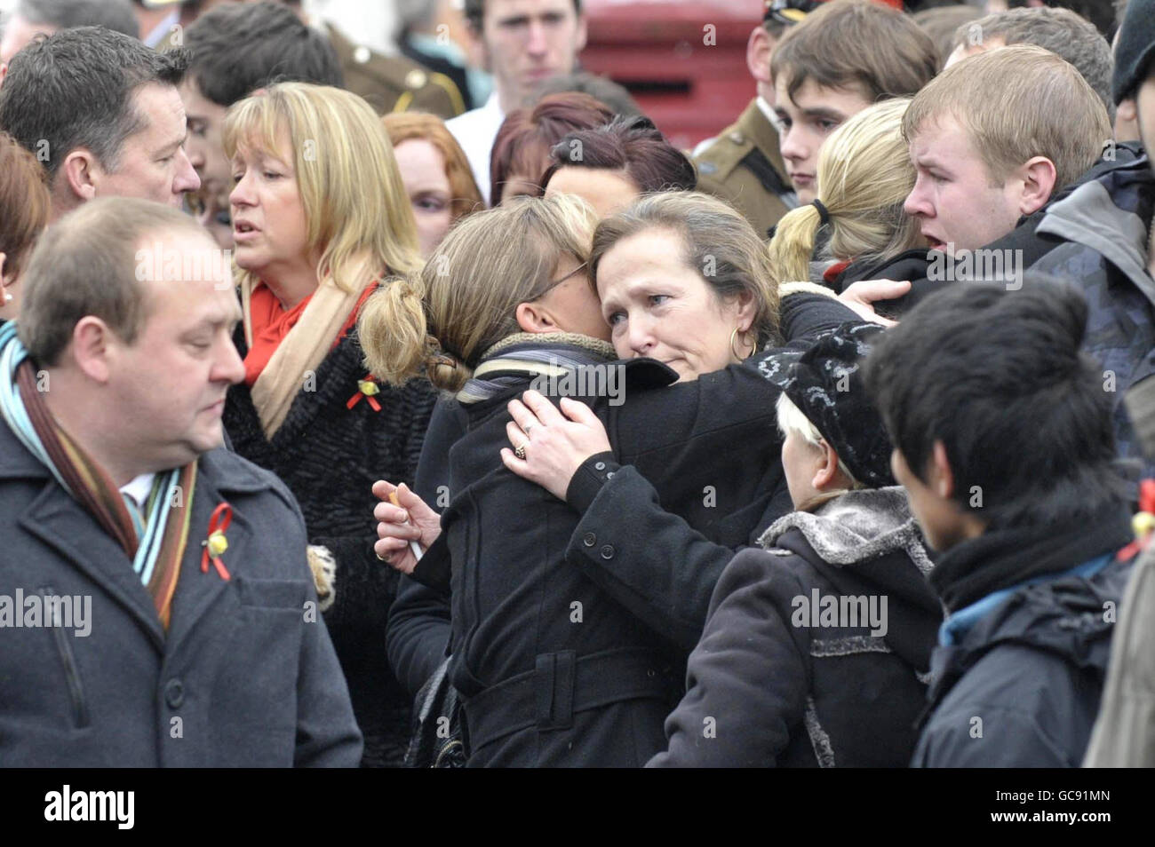 Diane Baldwin (centre), mother of Private Robert Hayes, grieves as the ...