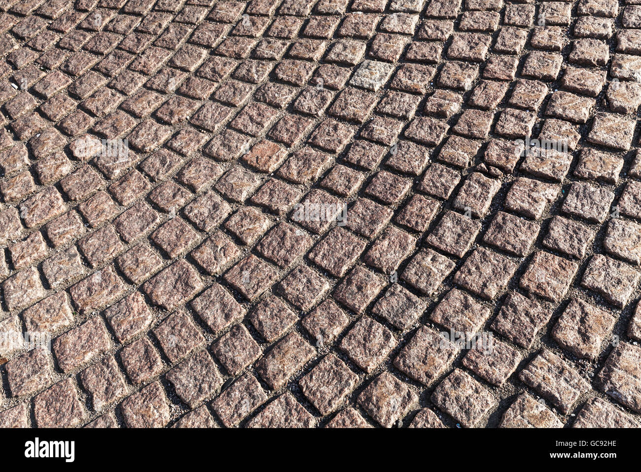 Brown cobblestone street pavement with round pattern, urban background ...